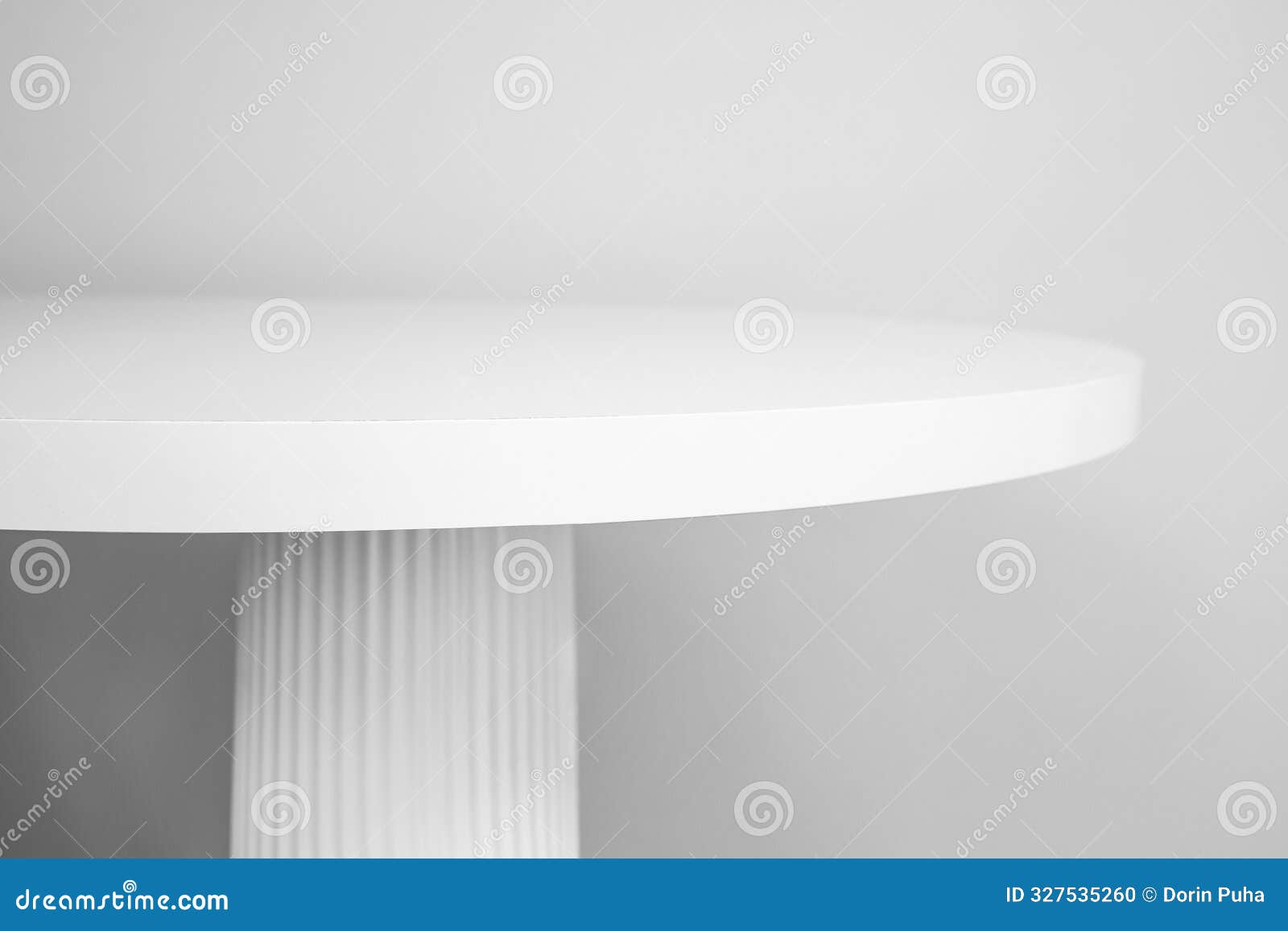 White Round Table Top with Column Leg, Side View on Gray Wall ...