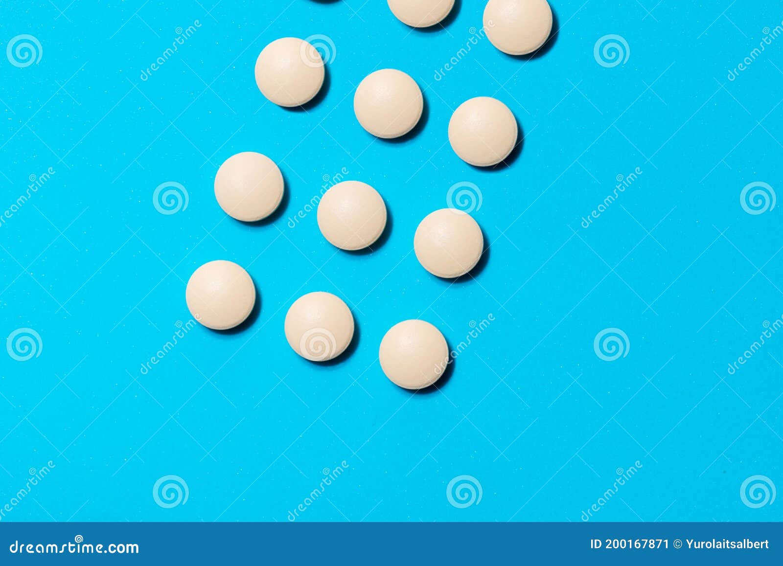White Round Tablets on a Blue Background. Stock Image - Image of ...