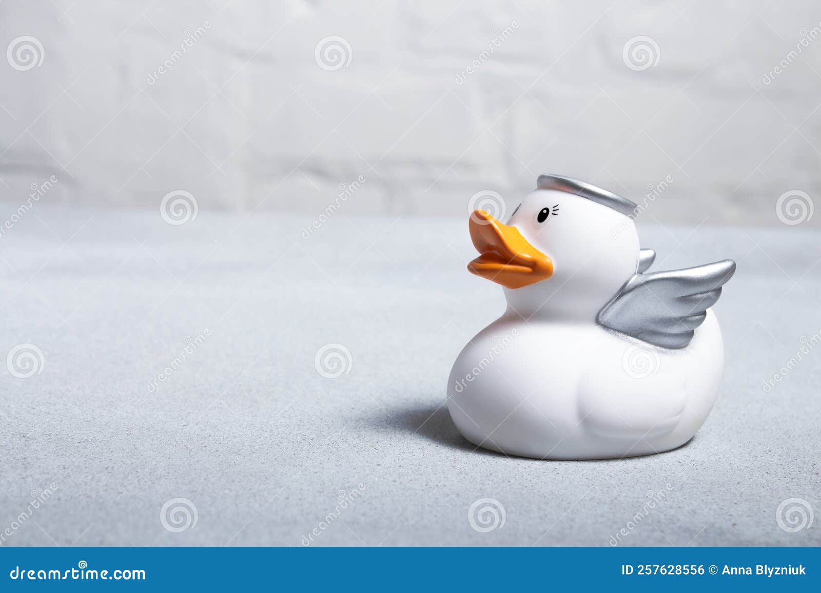 White Rubber Duck for a Bath in the Form of an Angel on a Light ...