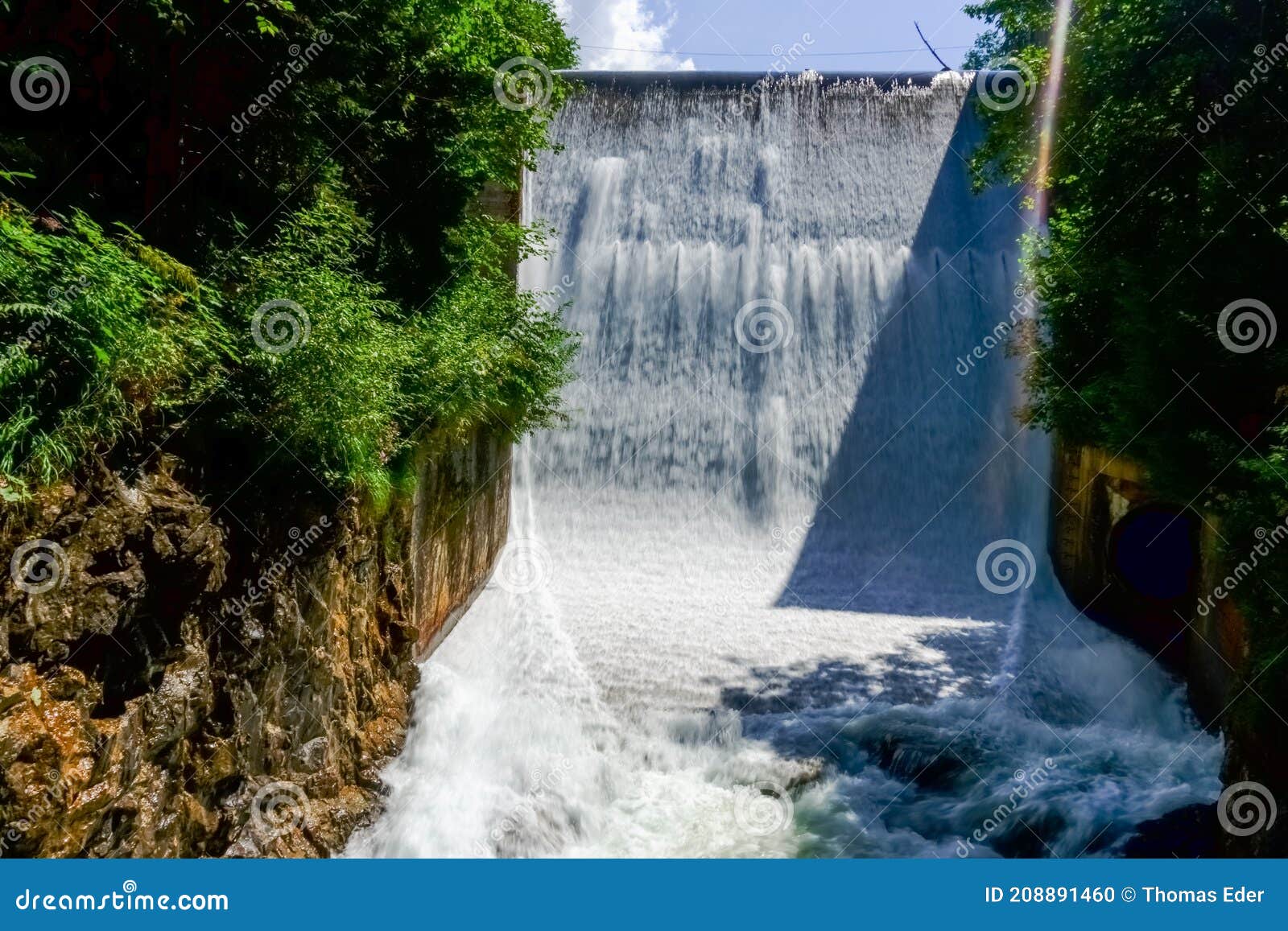 White Rushing Waterfall Over a Dam Wall from a Lake Stock Photo - Image ...