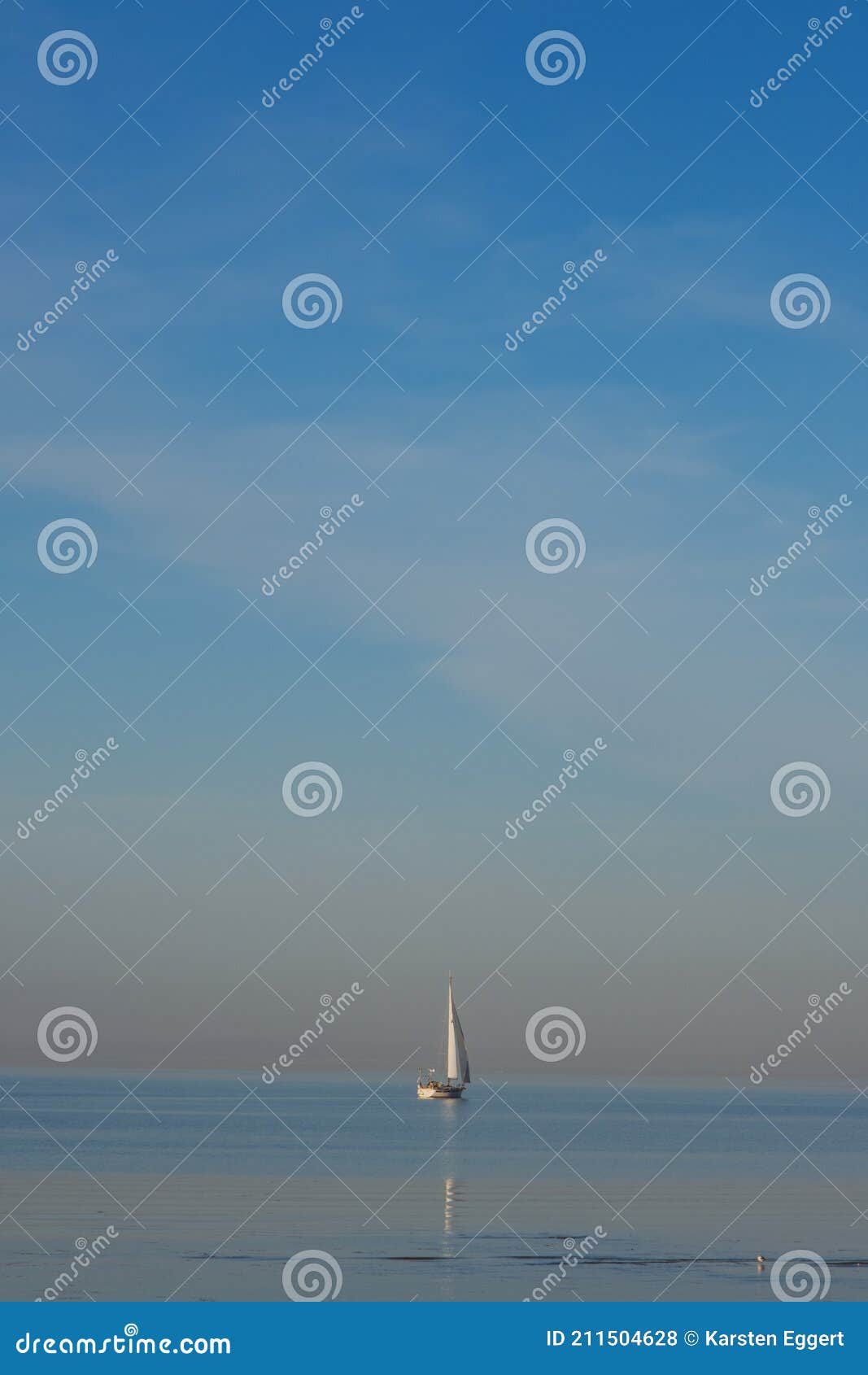 White Sailing Ship Floats on the Sea and the Water is Very Still Stock ...