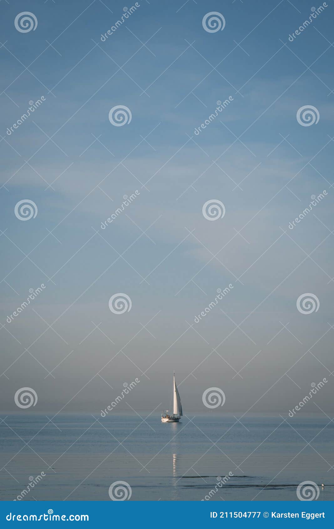 White Sailing Ship Floats on the Sea and the Water is Very Still Stock ...