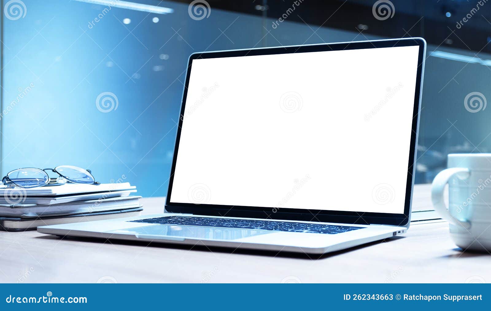 White Screen on Display Laptop with Notebook and Glasses on Table in ...