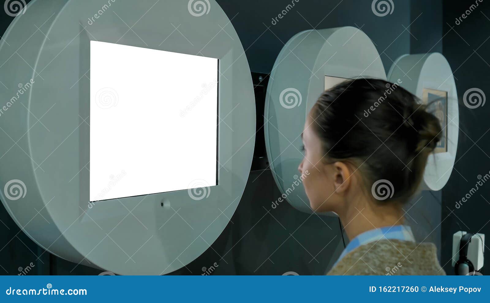 Woman Looking at Blank White Display Wall at Exhibition - White Screen ...