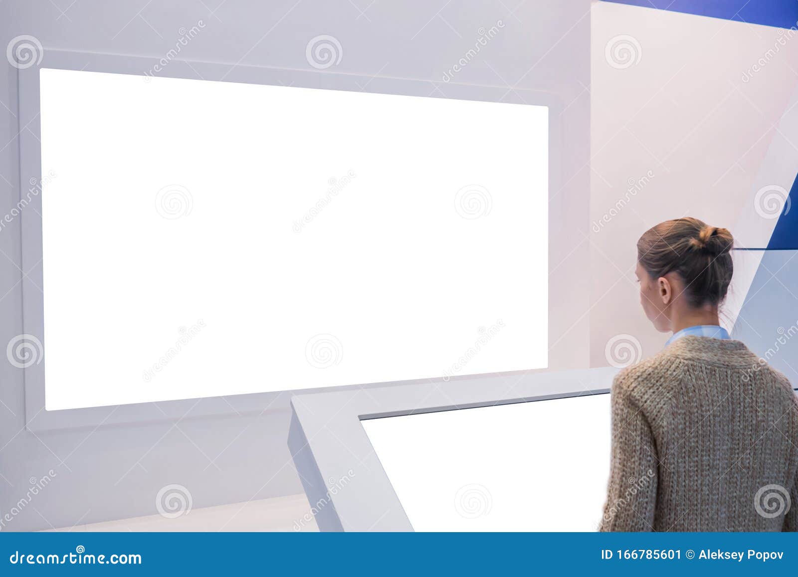 Woman Looking at Blank White Display Wall at Exhibition - White Screen ...