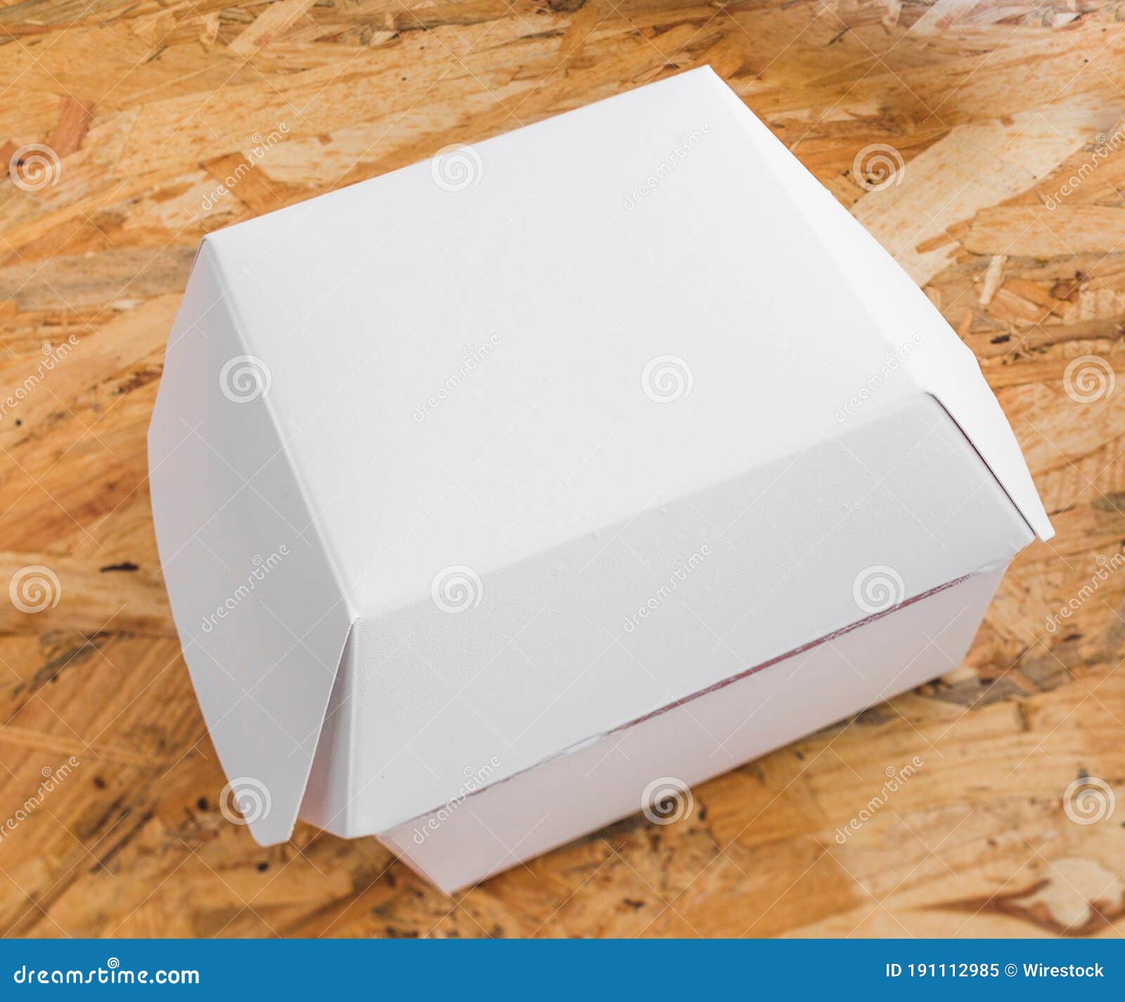 White Self-assembled Box on Wooden Background Stock Image - Image of ...