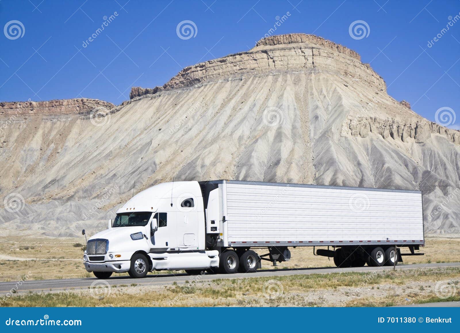 White Semi Trailer Truck Driving On Wide Straight Highway In ...