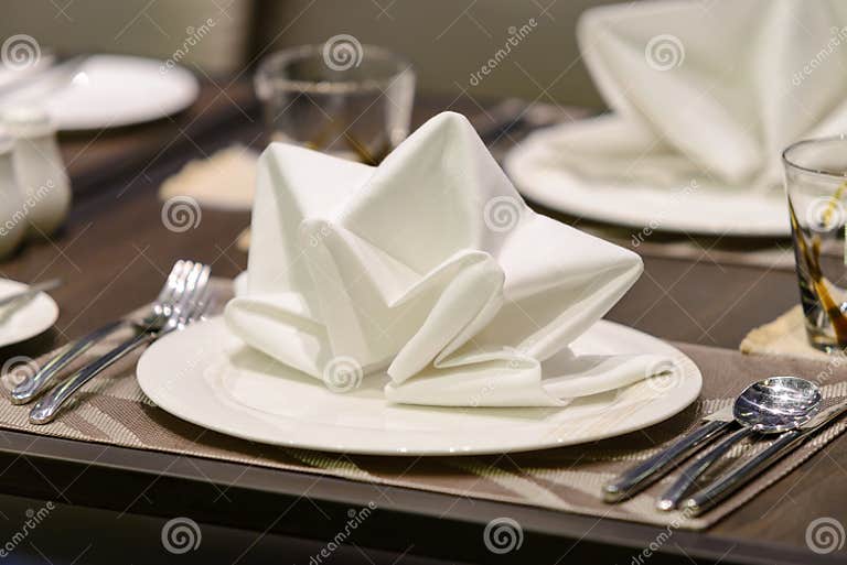 White Serviette Decorated on Dinner Set Table Stock Photo - Image of ...