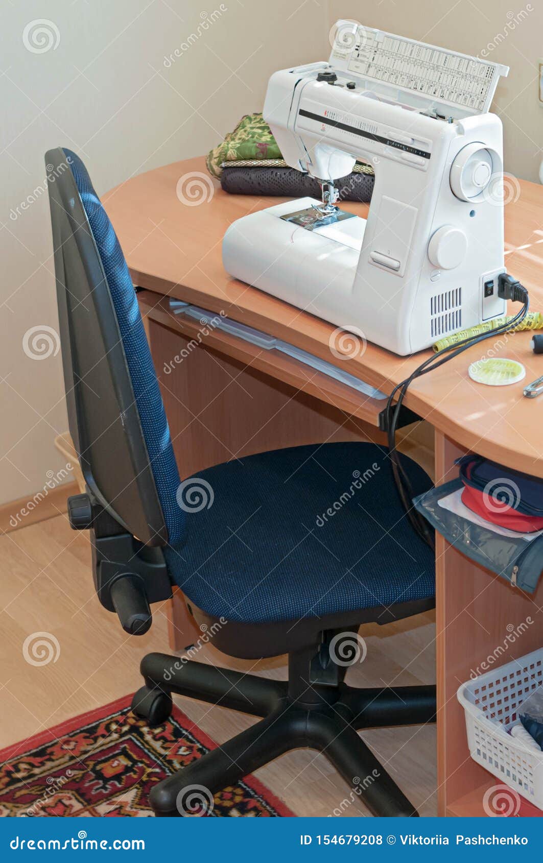 White Sewing Machine and Blue Chair in Sewing Studio Stock Photo ...