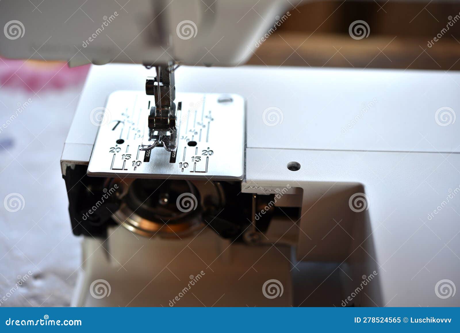 A White Sewing Machine in the Room. Processing of Clothes with a Sewing ...