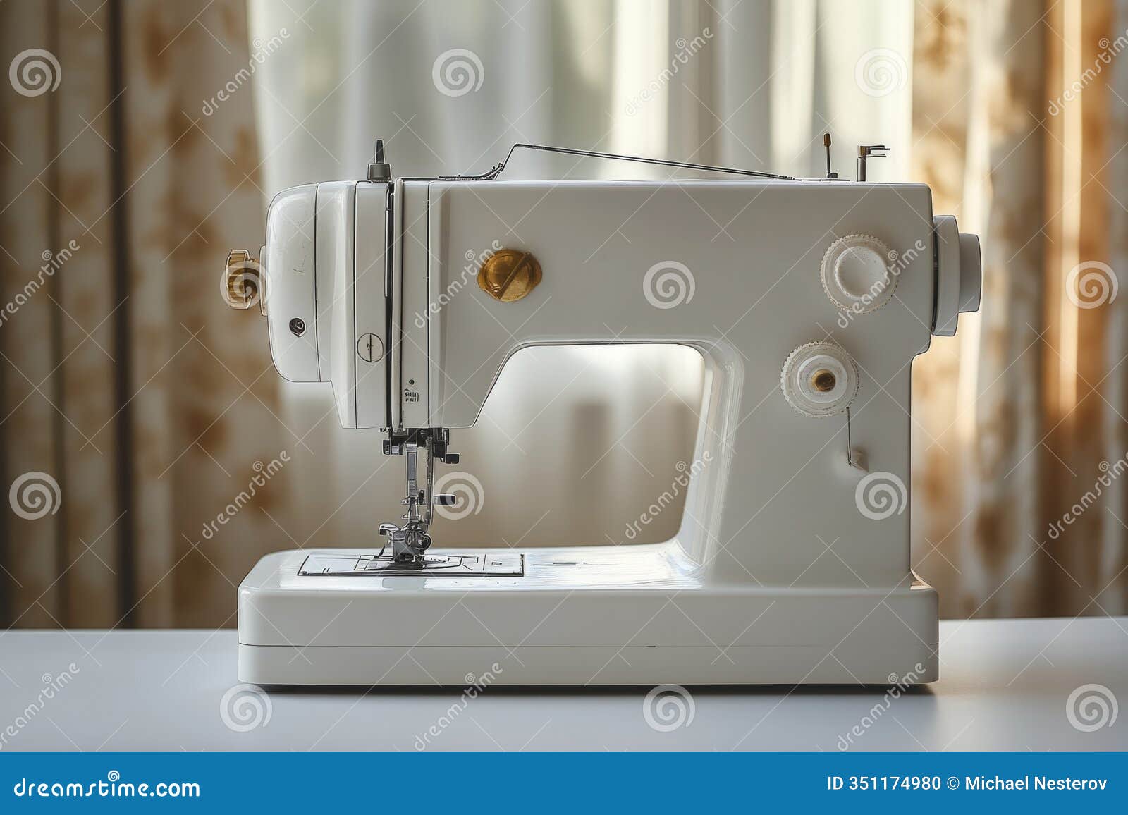 White Sewing Machine Standing on a White Table in a Brightly Lit Room ...