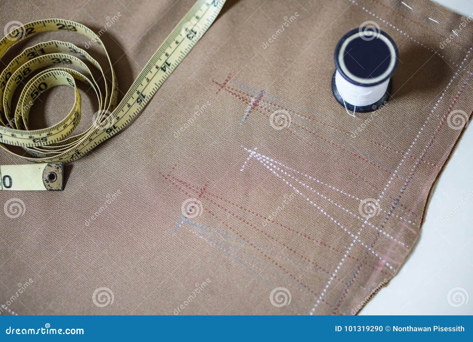 White Sewing Thread and Soft Measuring Tape on Fabric Textile for ...