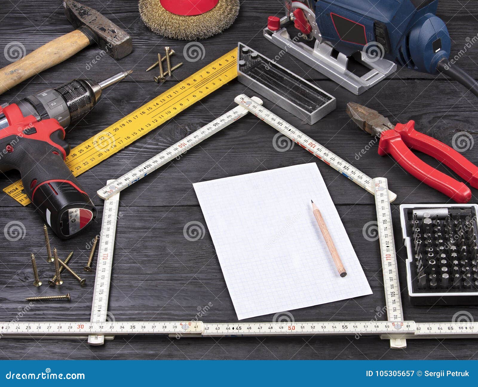 Tool for Construction and Repair on a Black Wooden Background Around a ...