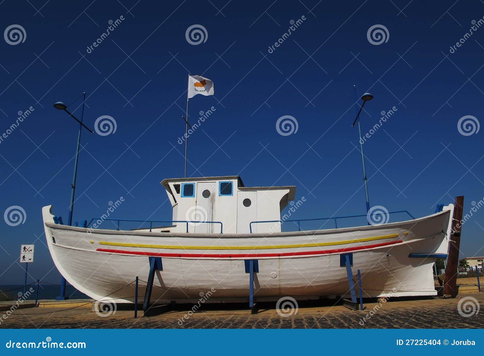 White ship on land stock photo. Image of flag, dock, boat - 27225404