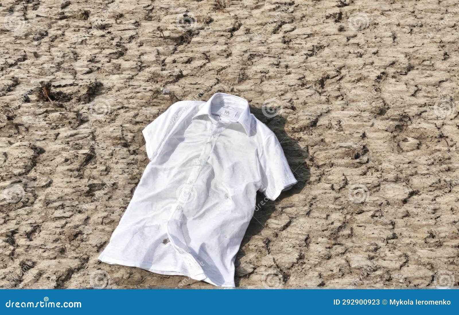 A White Shirt Lying on the Ground Stock Image - Image of ground, cloth ...
