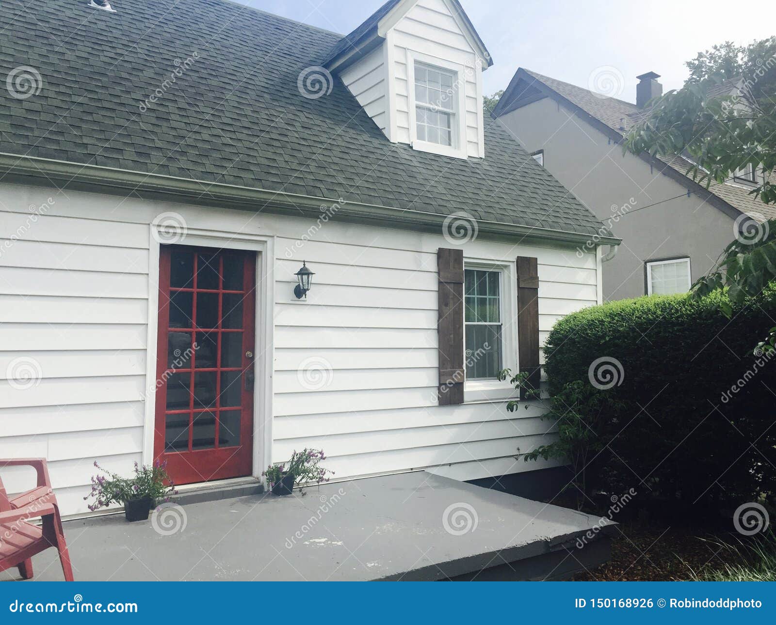 Cape Cod House with Red Door Stock Photo - Image of siding, white ...