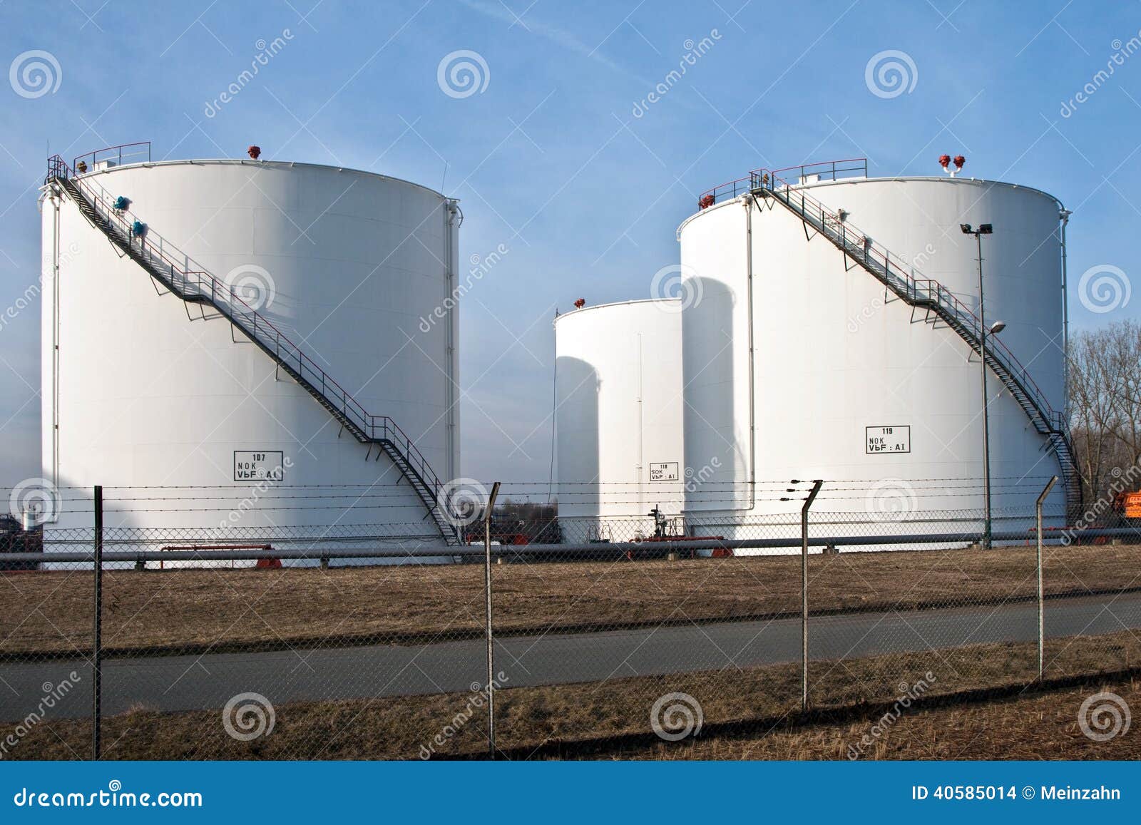 White Silo Tanks in a Tank Farm with Blue Sky Stock Photo - Image of ...