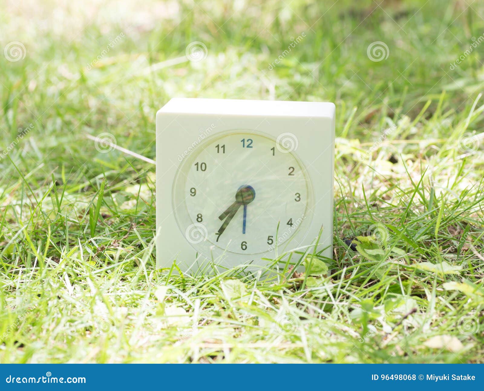 White Simple Clock on Lawn Yard, 7:35 Seven Thirty Five Stock Photo ...