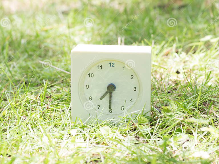 White Simple Clock on Lawn Yard, 7:30 Seven Thirty Half Stock Image ...