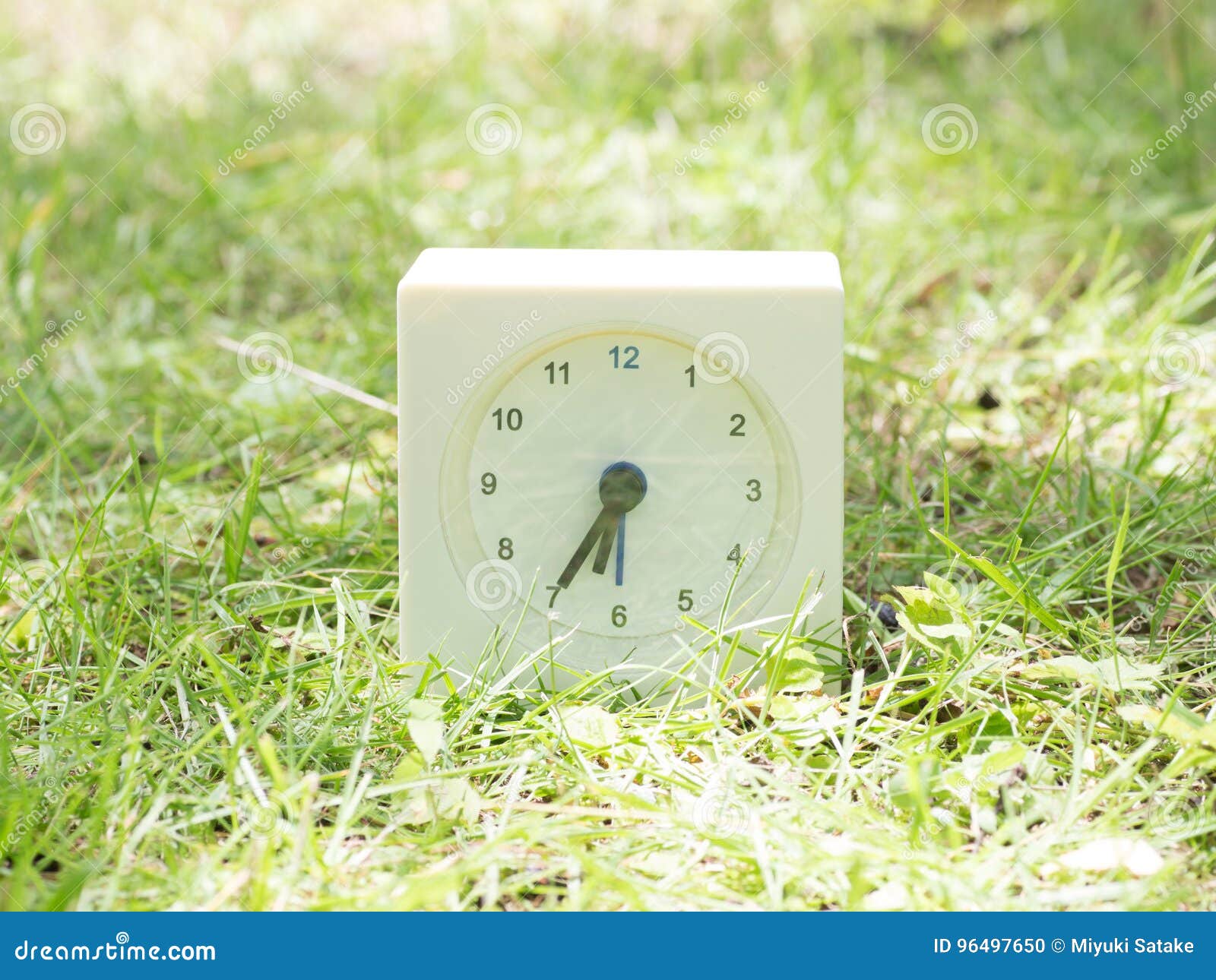 White Simple Clock on Lawn Yard, 6:35 Six Thirty Five Stock Photo ...