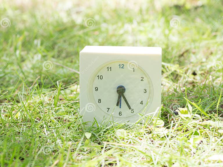 White Simple Clock on Lawn Yard, 6:25 Six Twenty Five Stock Image ...
