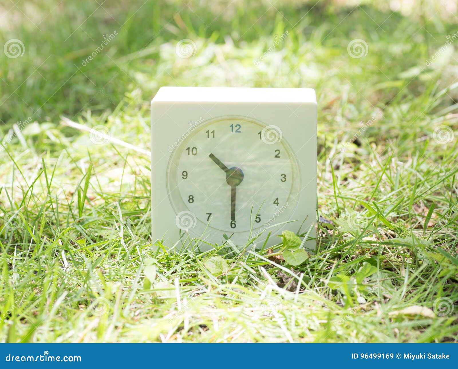 White Simple Clock on Lawn Yard, 10:30 Ten Thirty Half Stock Image ...