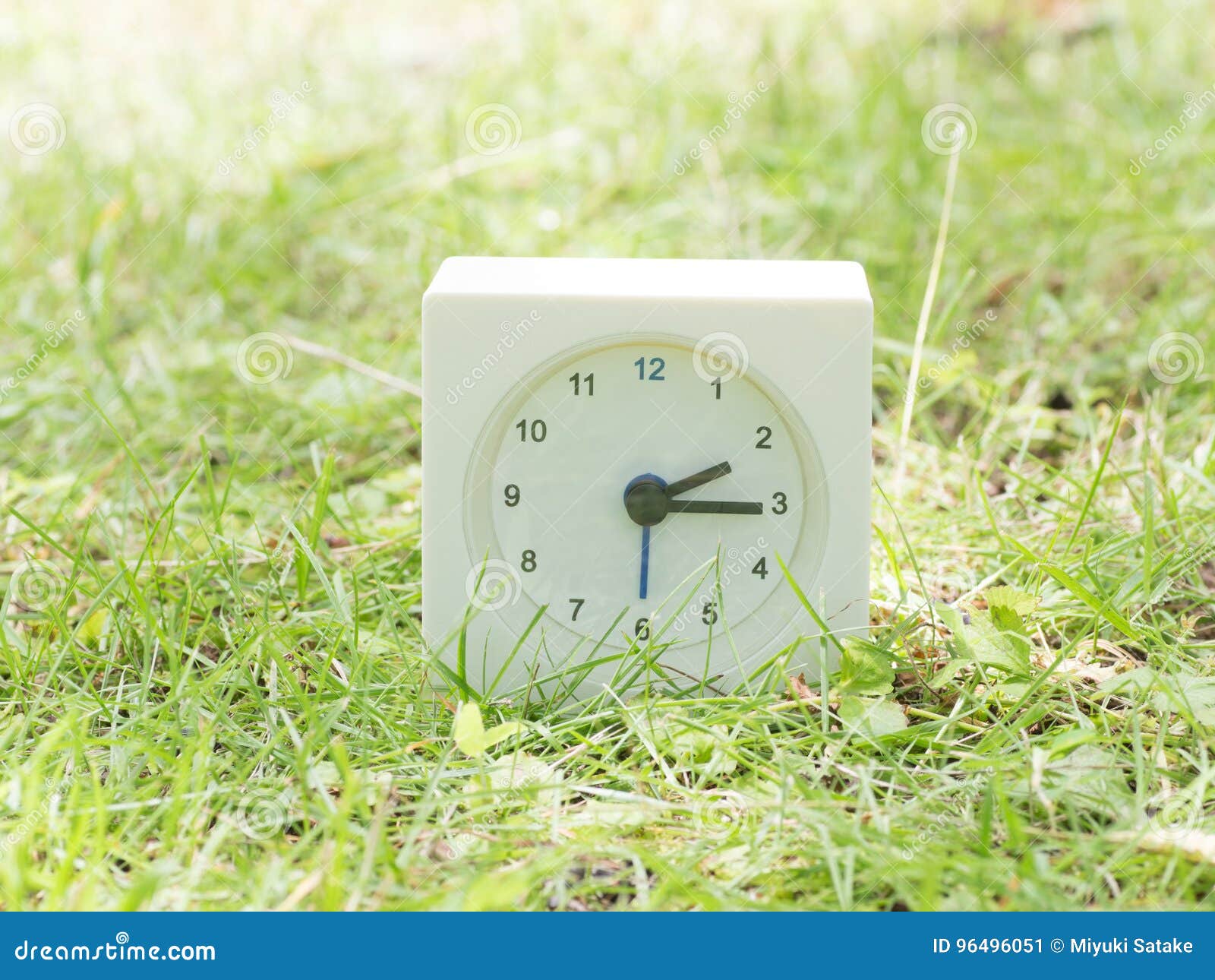 White Simple Clock on Lawn Yard, 2:15 Two Fifteen Stock Image - Image ...