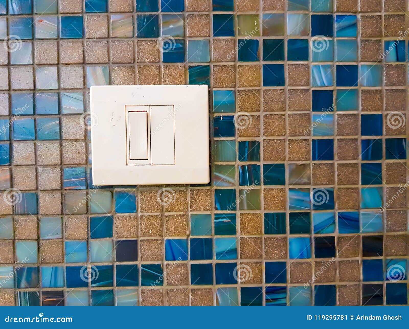 White Single Plastic Switch on a Tiled Wall Design Stock Image - Image ...