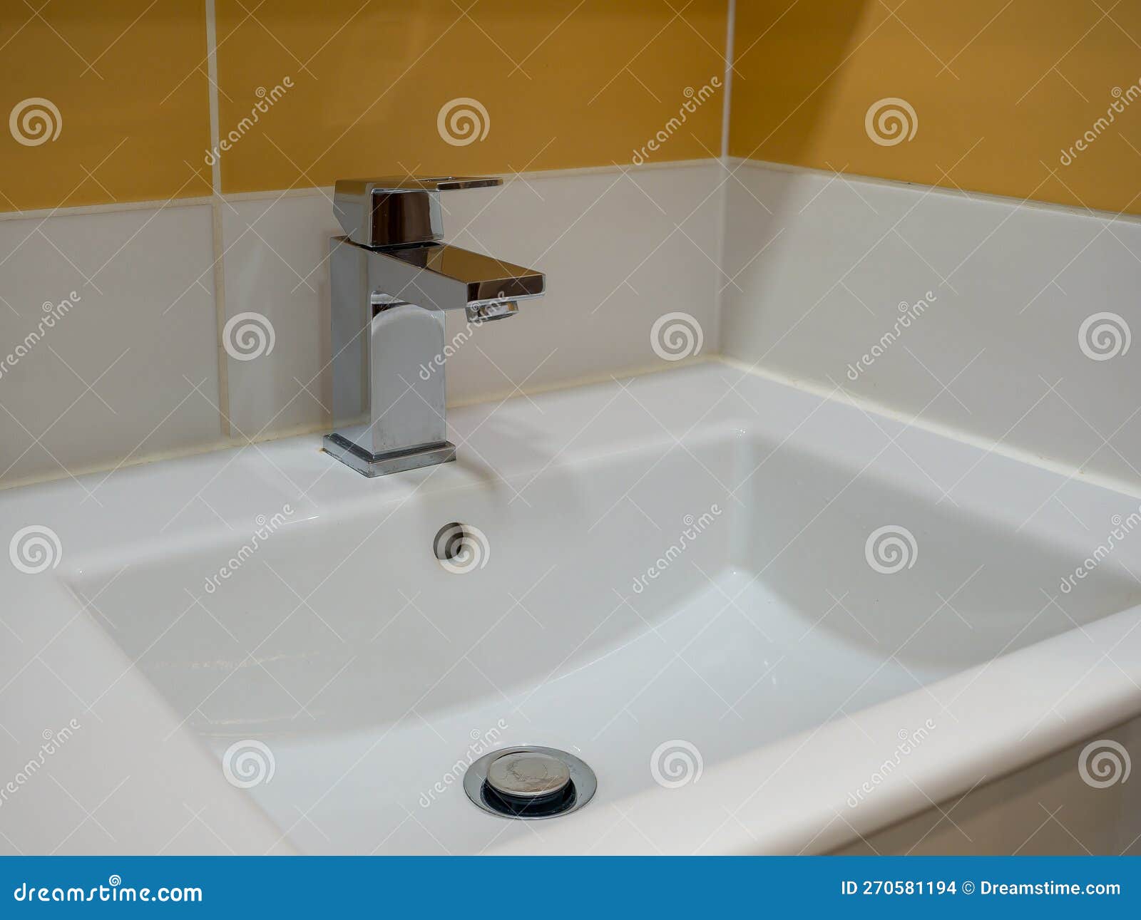 A White Sink in a Modern Bathroom with a Square Faucet Stock Photo ...
