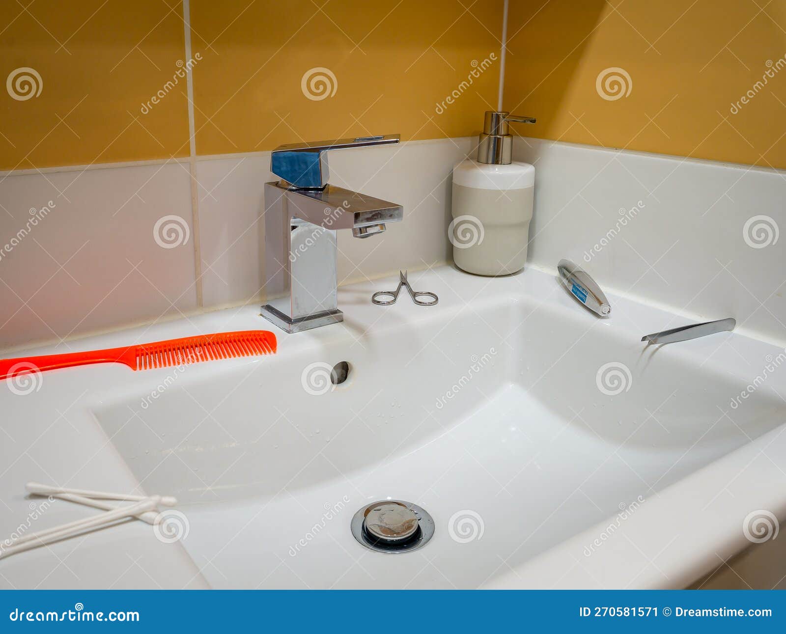 A White Sink in a Modern Bathroom with a Square Tap and Sanitary Ware ...