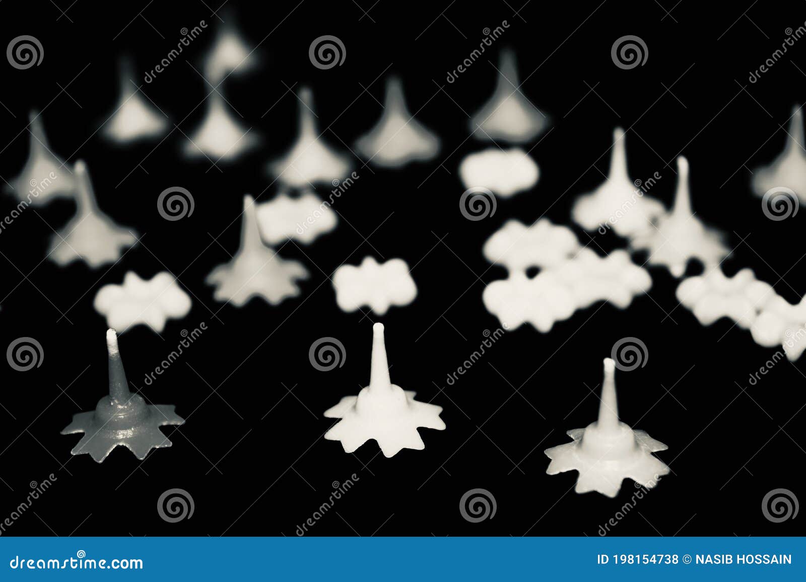 White Small Plastic Objects with Black Background Stock Photo - Image ...