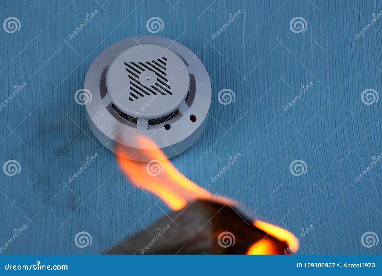 White Smoke Detector on a Blue Wall and a Fire Stock Image - Image of ...