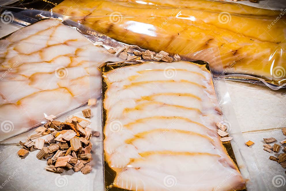 White Smoked Fish in a Sealed Vacuum Package on the Background of a ...