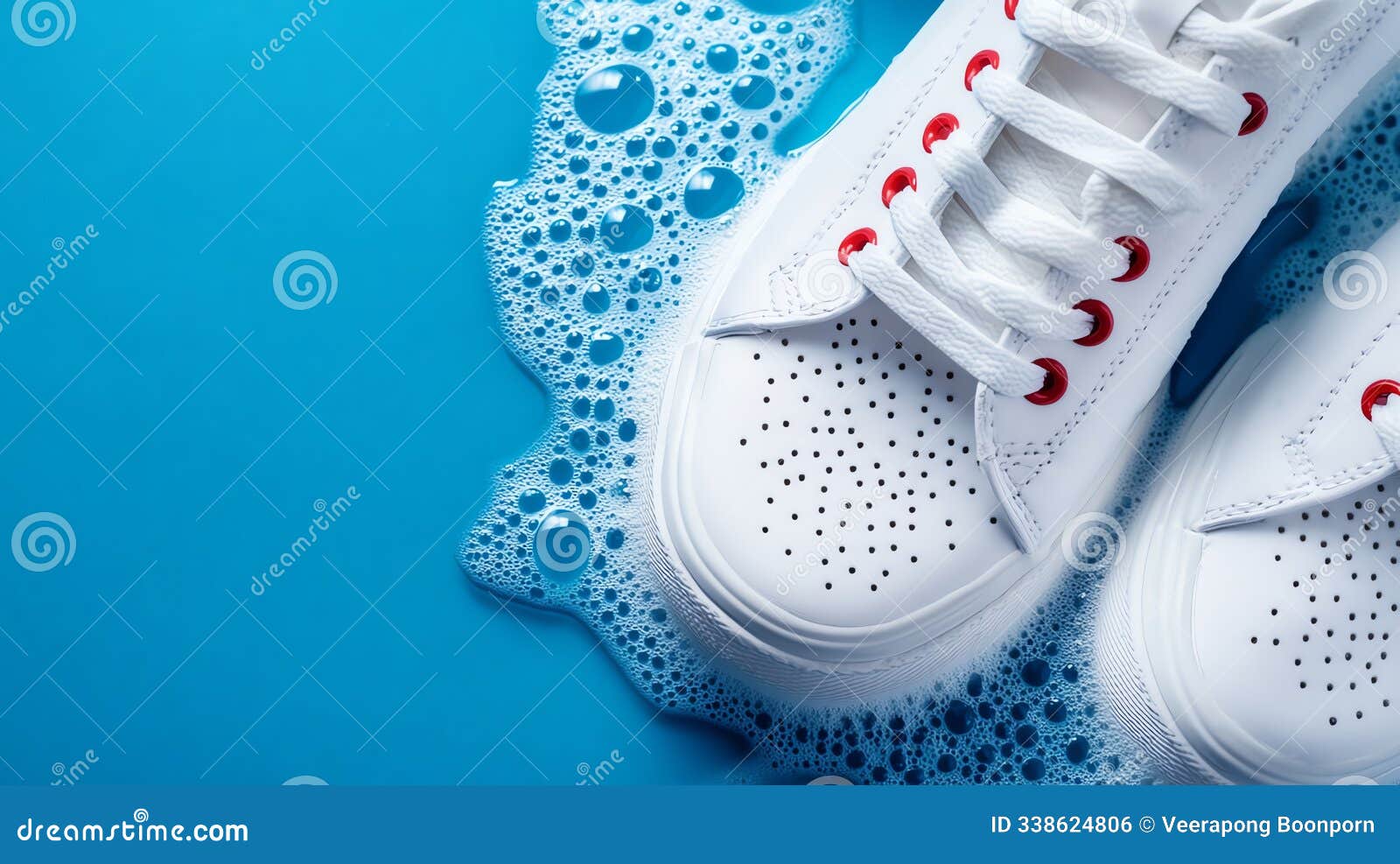 White Sneakers Resting on Blue Surface with Soap Bubbles, Vibrant Clean ...