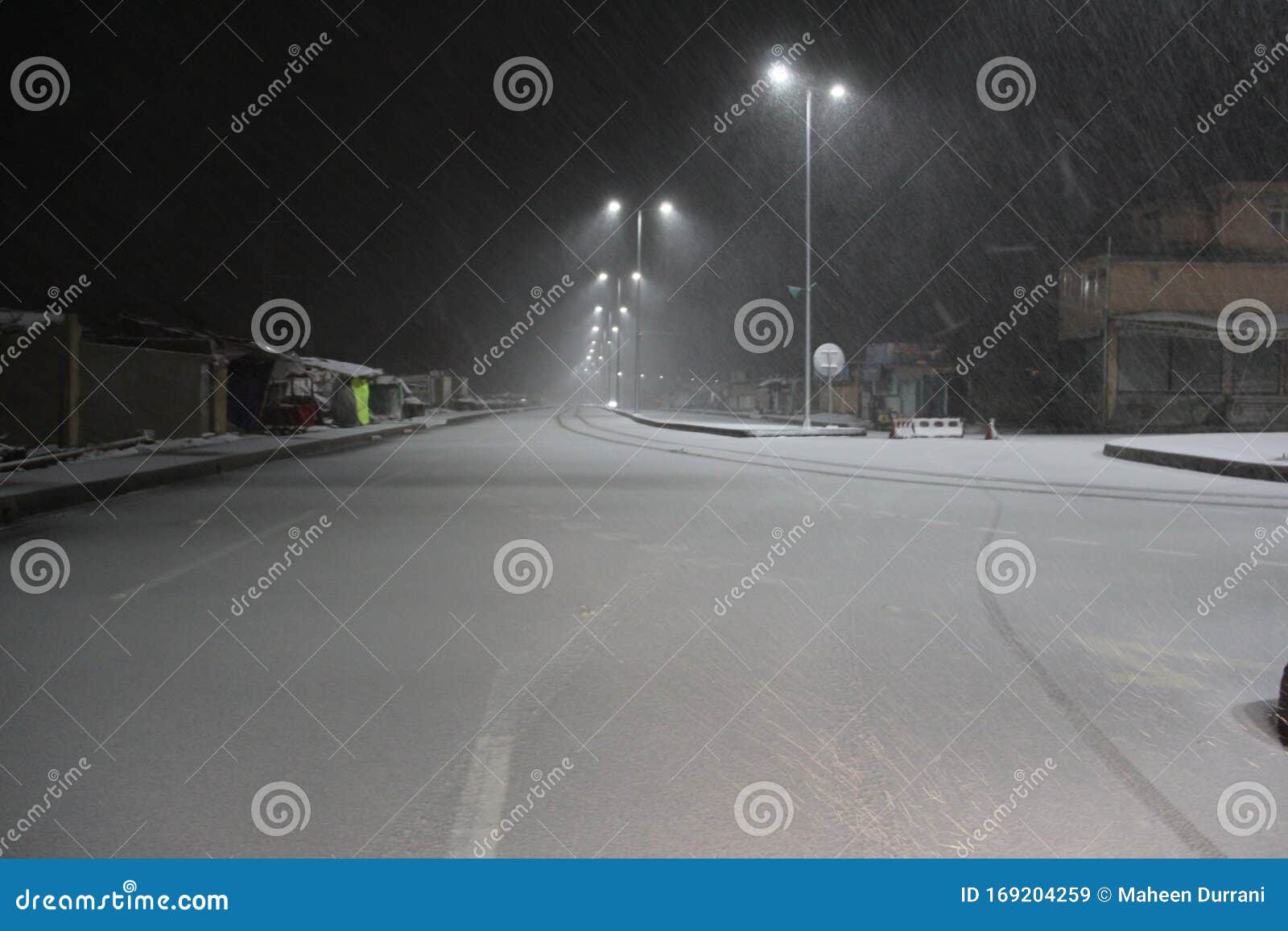 White Snow on the Road with Street Lights Stock Image - Image of winter ...