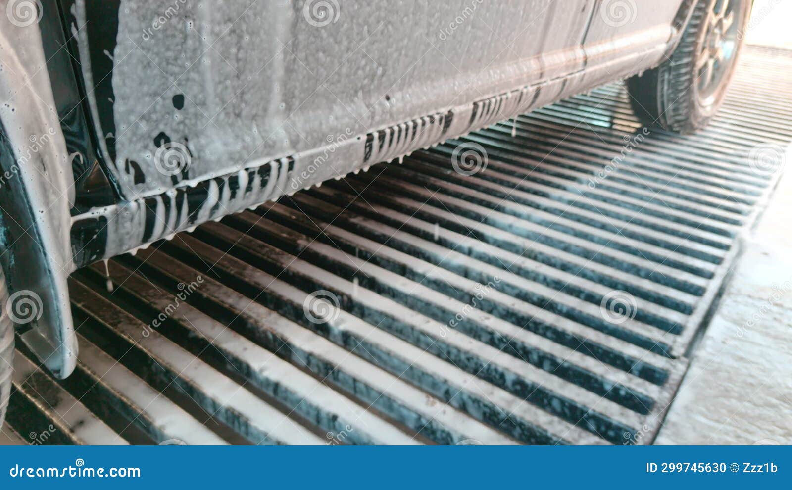 White Soap Sud of Detergent Dripping Down from Black Car during Car ...