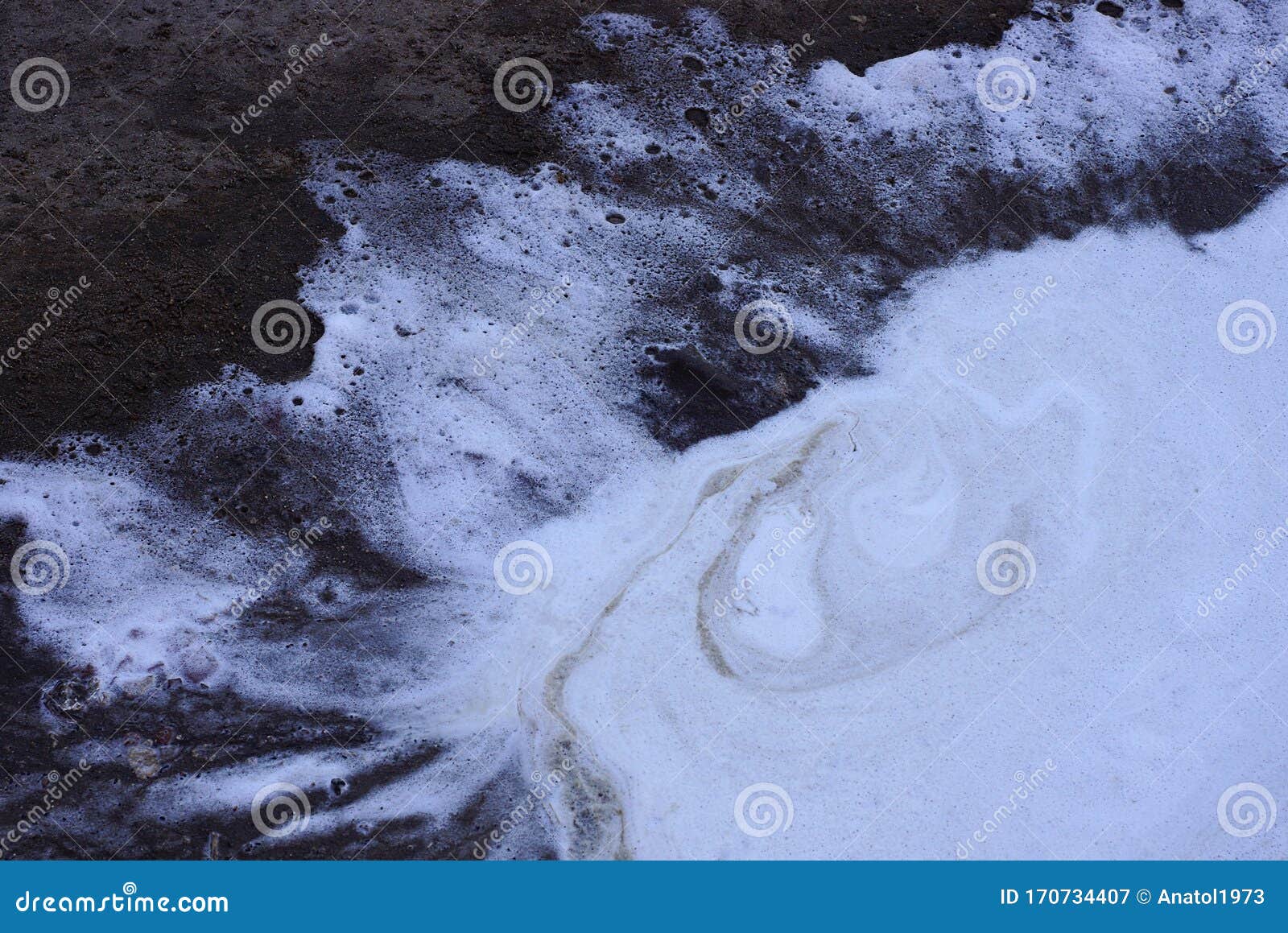 White Soapy Foam in Gray Dirty Water in a Puddle on the Ground Stock ...