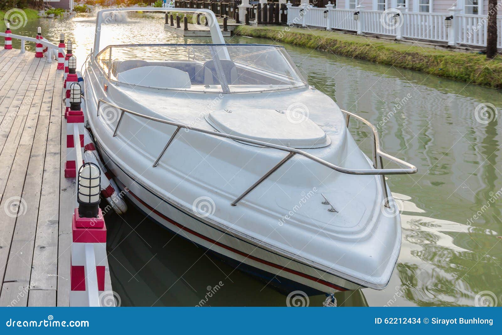 A White Speedboat Docked on a River Stock Photo - Image of marine, deck ...