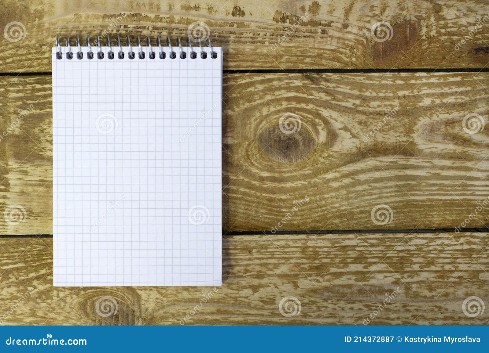 White Spring Notepad with Blank Space for Writing on Brown Wooden ...