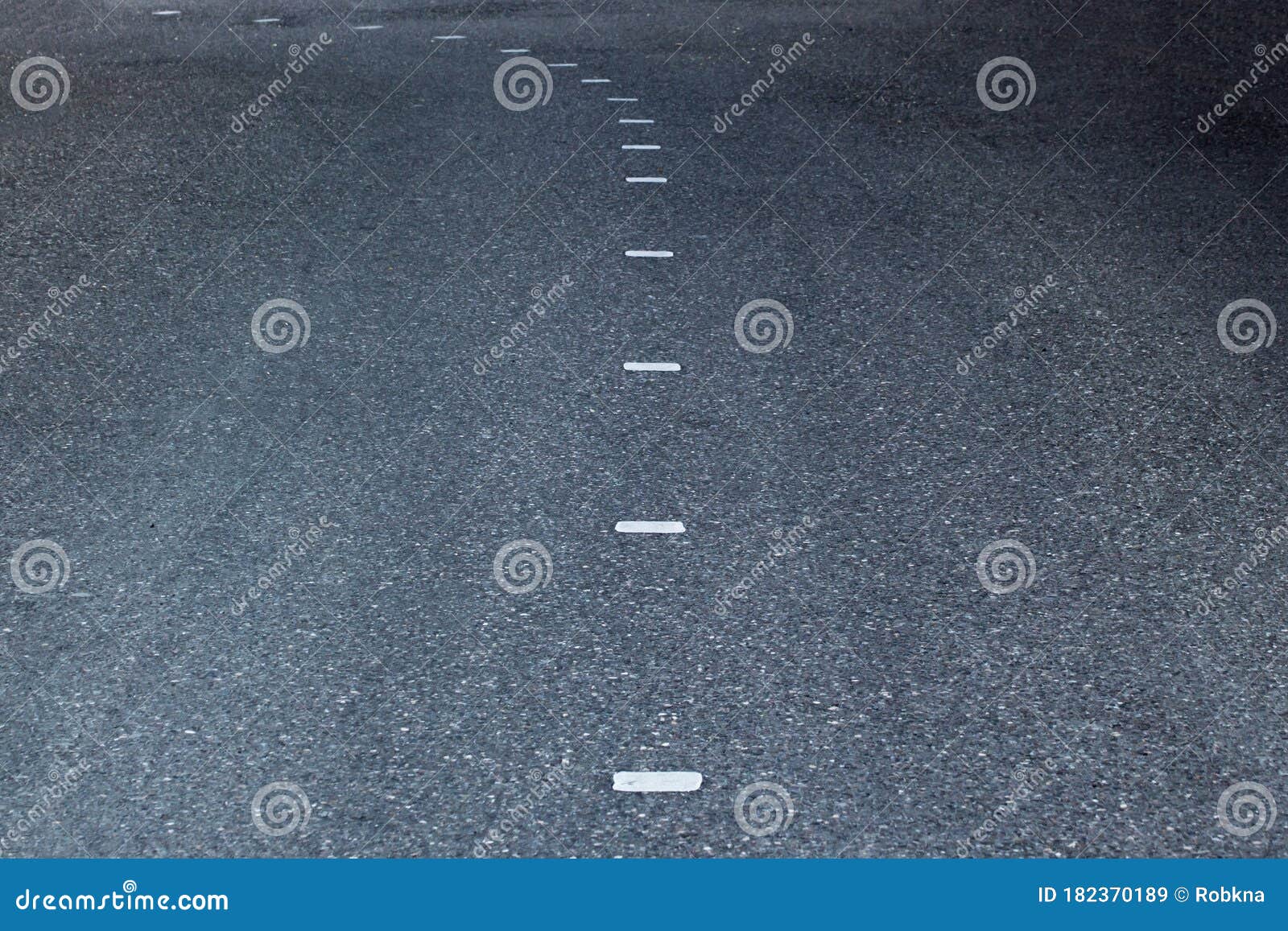White Square Road Markings Making a Curve in the Distance Stock Image ...