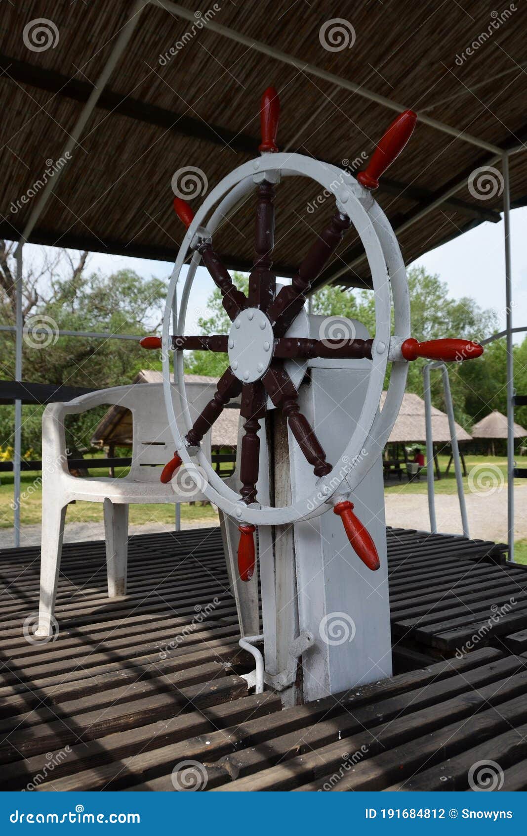 White Steering Wheel on Boat with Red Handles Stock Photo - Image of ...