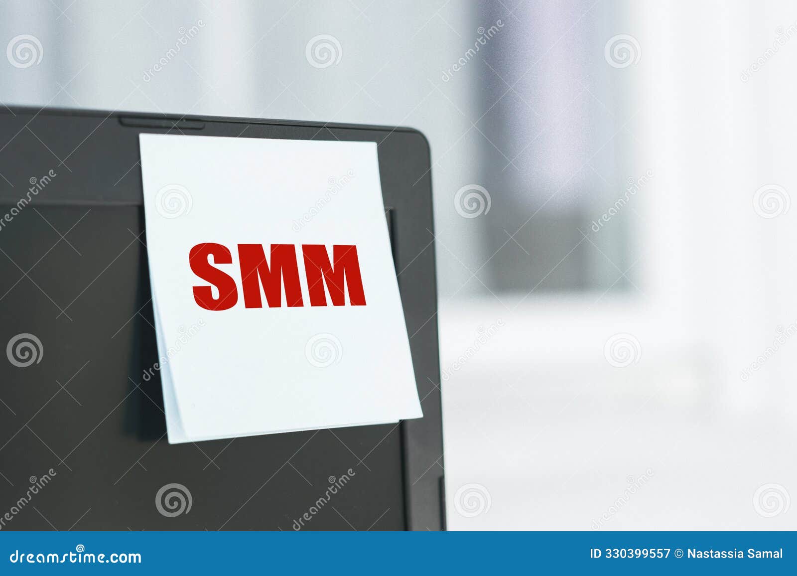 A White Sticky Note with the Word SMM Written in Red is on a Black ...