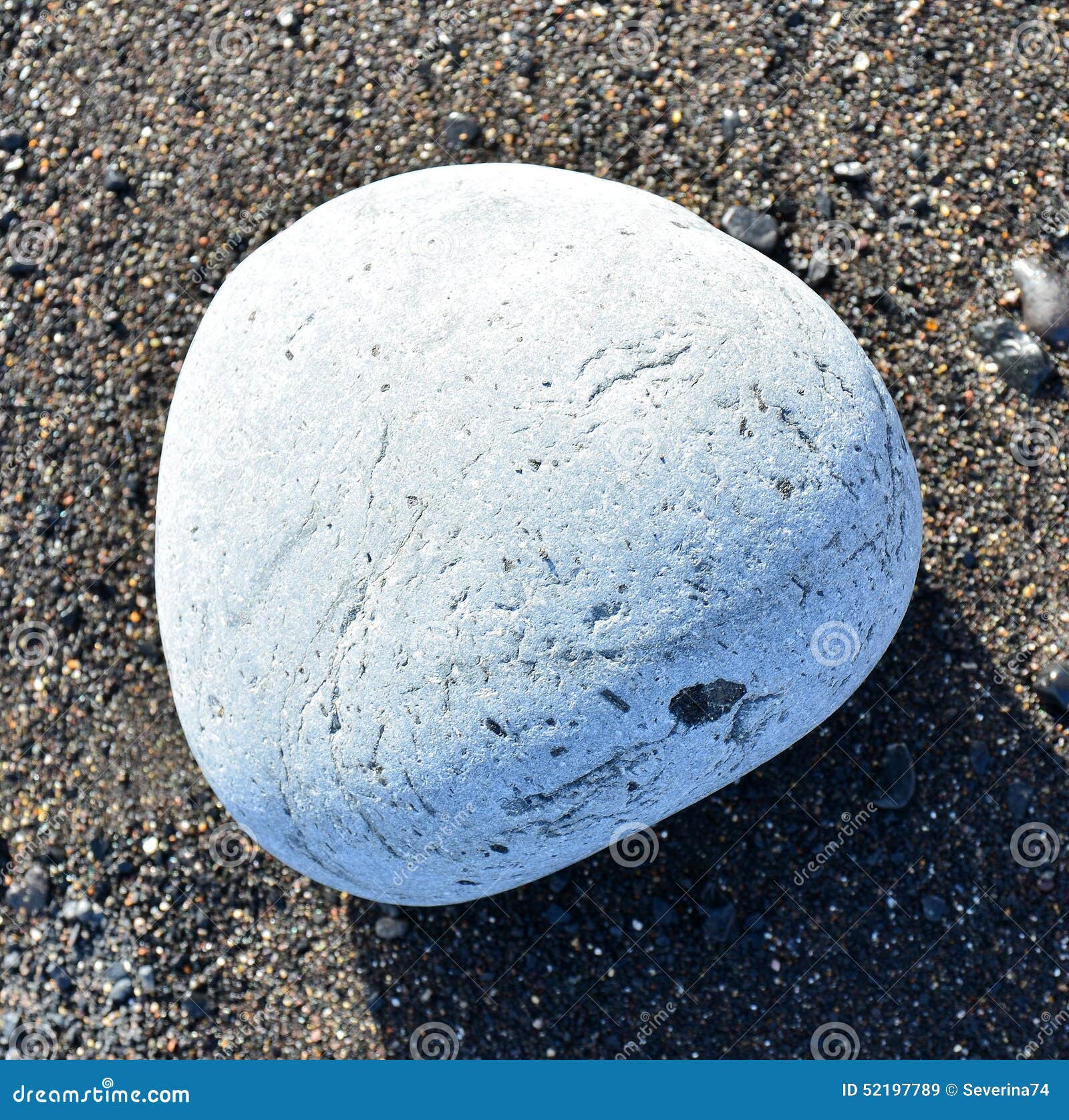 White Stone on a Dark Sand. Stock Image - Image of coast, design: 52197789