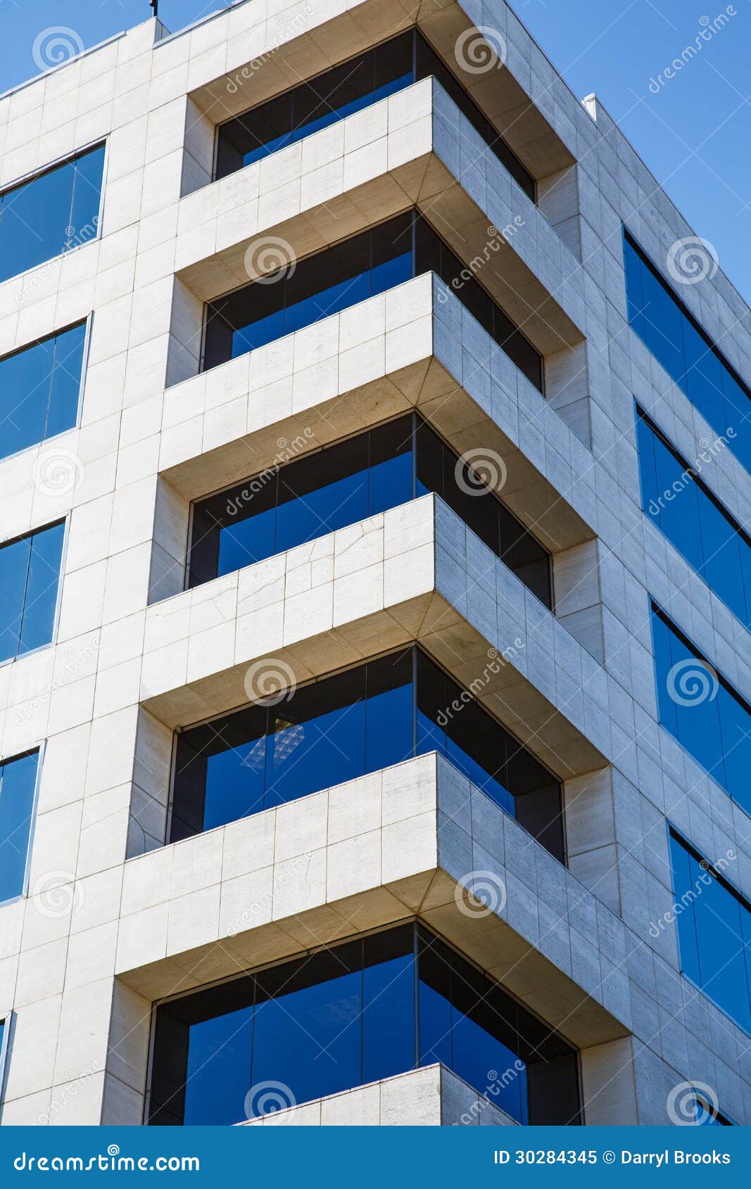 Corner of White Marble Building with Blue Glass Windows Stock Image ...