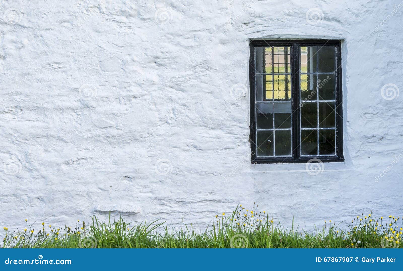 White, Stone Wall with a Black Window Frame Stock Image - Image of ...