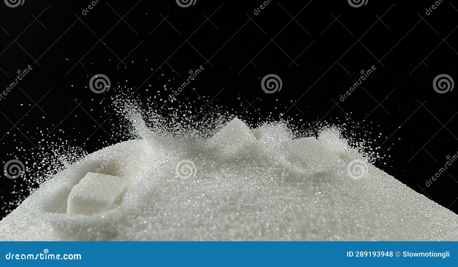 White Sugar Cube Falling on Powder Sugar Against Black Background Stock ...
