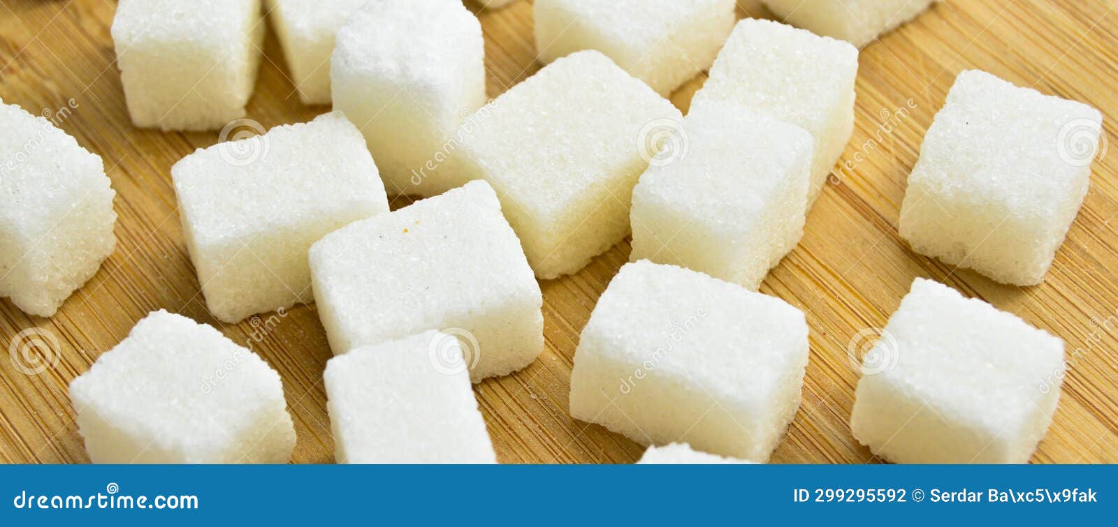 White Sugar Cubes on Bamboo Cutting Board, Sugar Cubes Texture Stock ...
