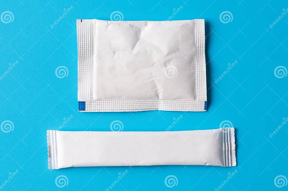 White Sugar Packets on a Blue Background Stock Image - Image of ...