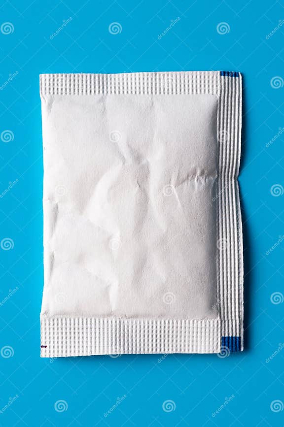 White Sugar Packets on a Blue Background Stock Image - Image of ...