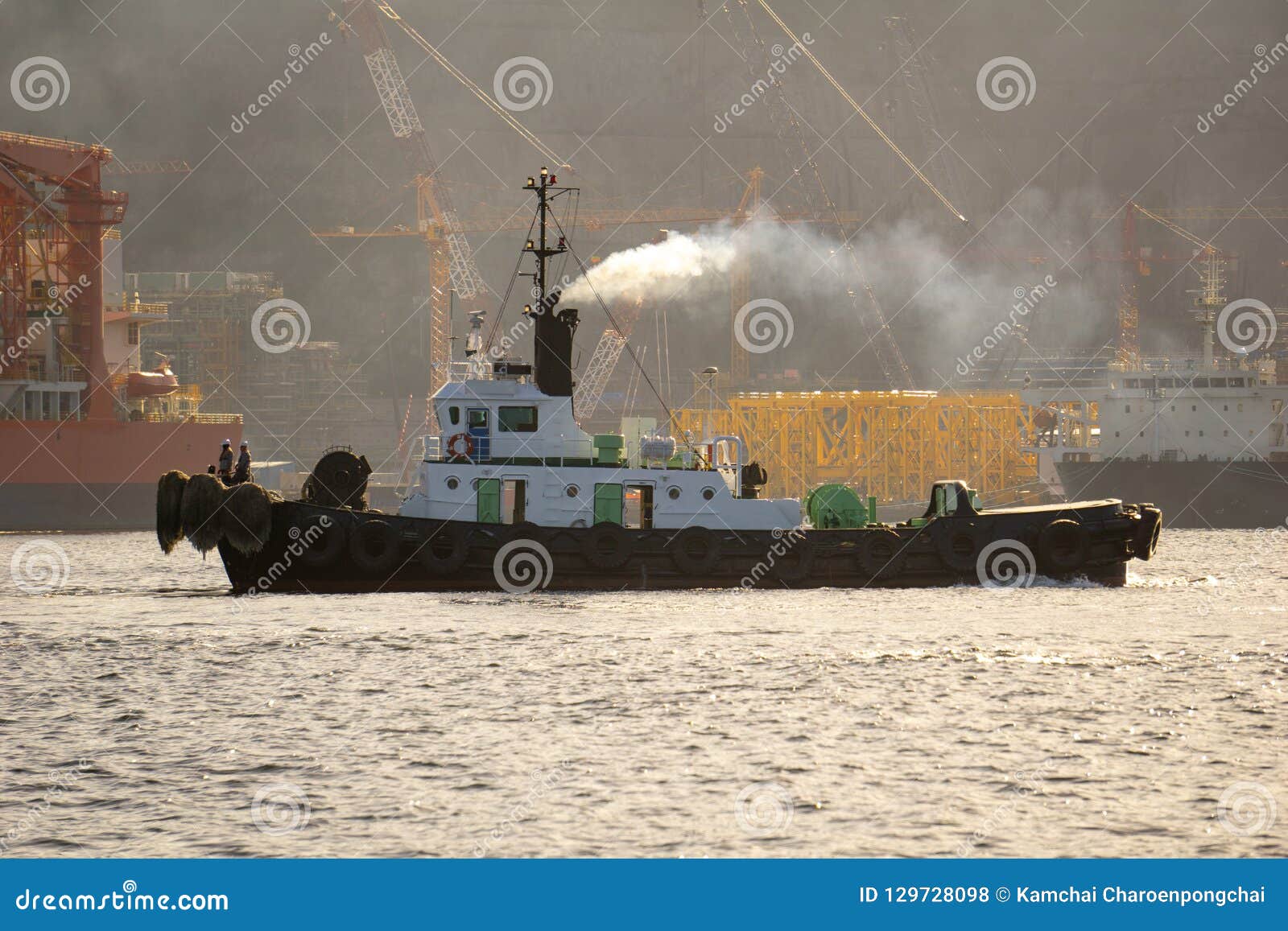 White Super Structure and Black Hull Tugboat is Sailing in the Shipyard ...
